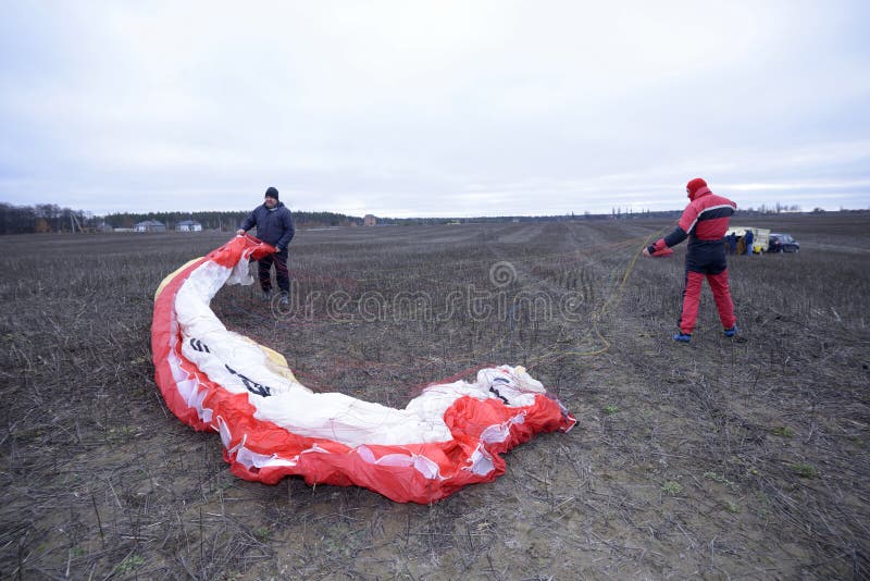 Paramotoring. Paramotorist Men Checking Equipment of Paramotor for ...