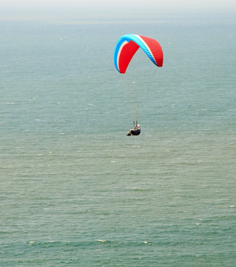 Paraplane Flight Over the Sea Stock Photo - Image of leisure, blue ...