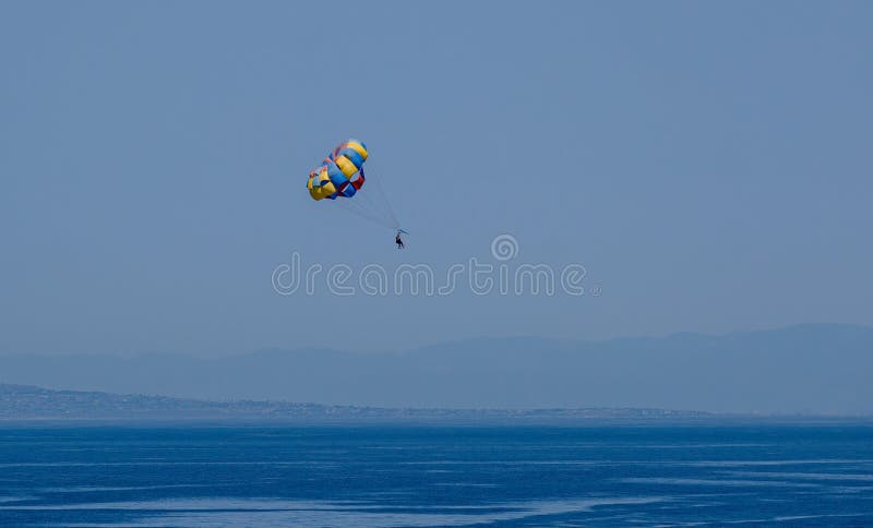 Parasailor on Blue stock image. Image of parachute, parasailor - 249910215