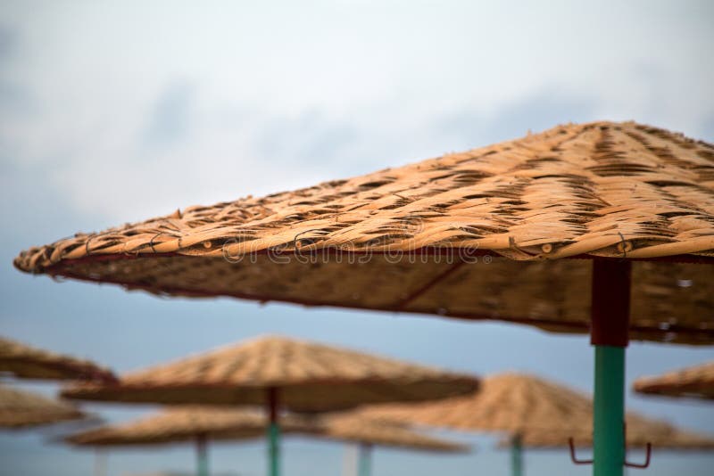 Parasol on sandy beach stock photo. Image of basket - 152563800