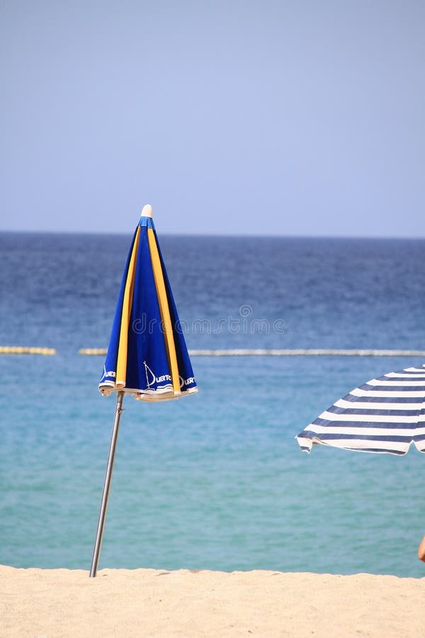 Parasol on the beach stock photo. Image of landscape - 19576712