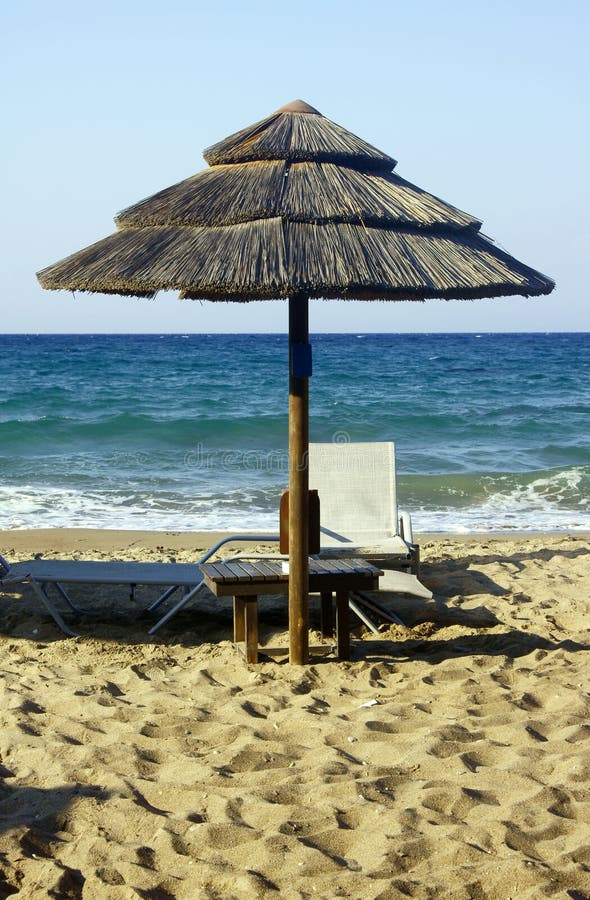 Parasol on the beach stock image. Image of stone, water - 23194201