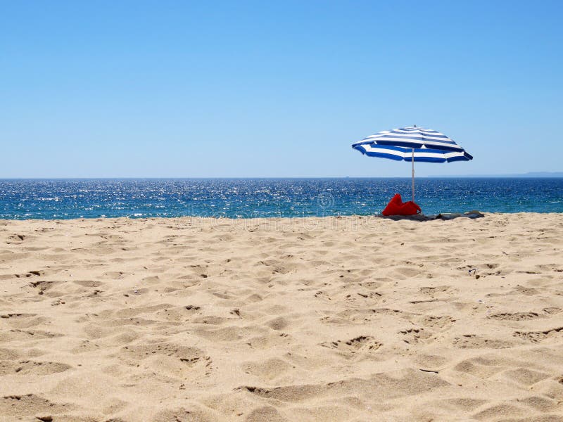Parasol on a Deserted Beach Stock Image - Image of skye, background ...