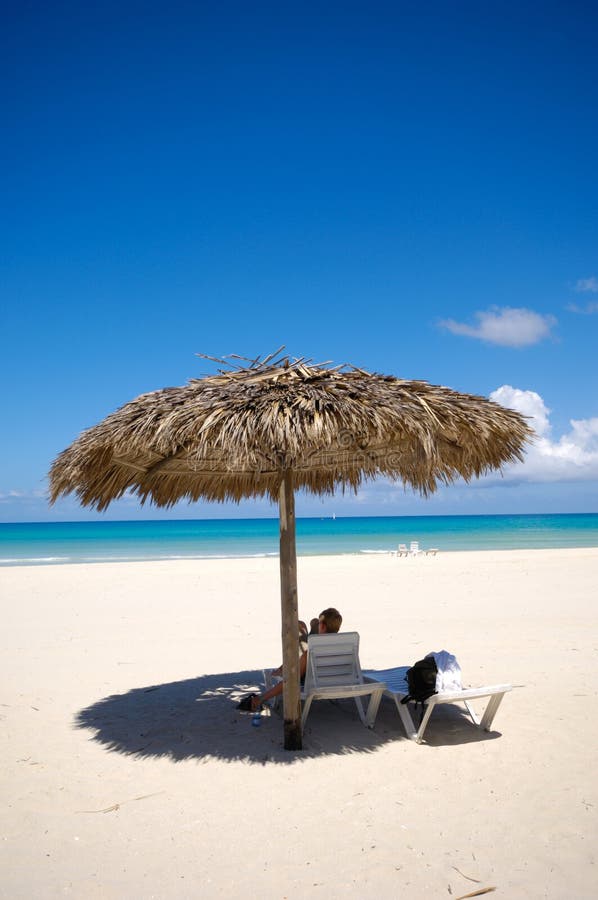 Parasol on exotic beach stock image. Image of enjoy - 354736981