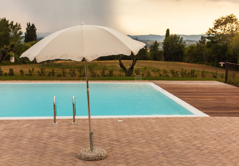 Parasol at the poolside stock image. Image of lounge - 32334775