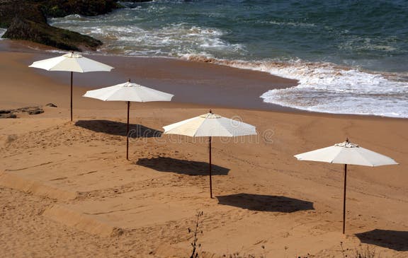 Parasol on a Sandy Beach. Ocean Stock Image - Image of sand, parasol ...