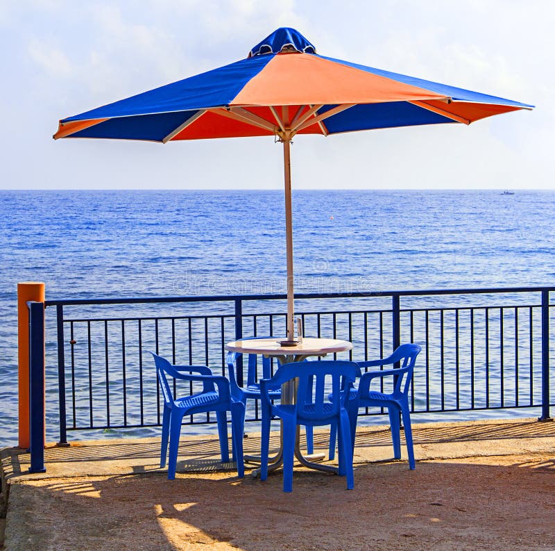 Parasol and Table in the Cafe on the Banks Stock Image - Image of ocean ...