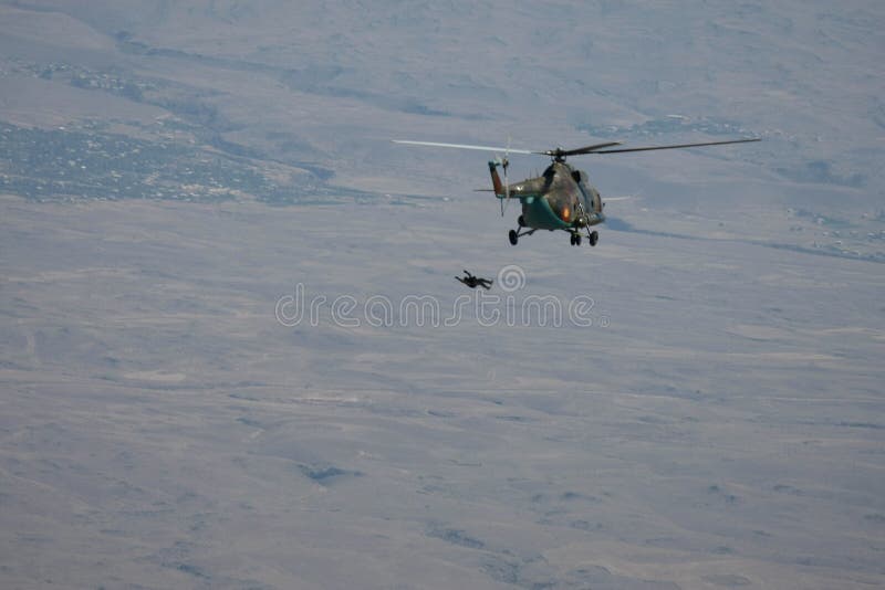 Paratrooper Jumping Out of a Helicopter in the Sky Stock Photo - Image ...