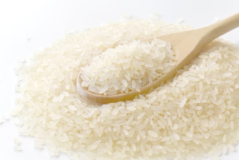 Uncooked Rice on Wood Spoon on White Background. Stock Image - Image of ...
