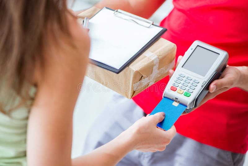 The Parcel Delivery Being Paid with Pos and Credit Card Stock Photo ...