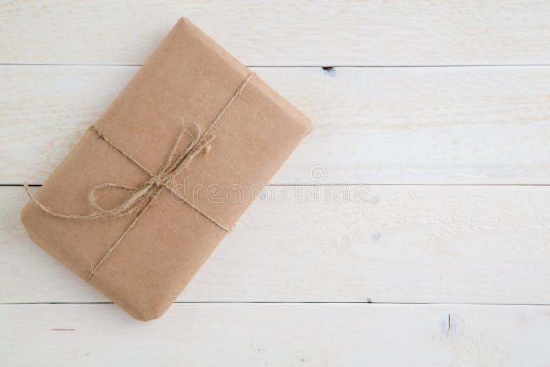 Parcel,gift Packed in Eco-friendly Paper on Light Wooden Background ...