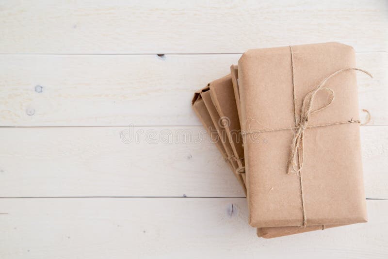 Parcel,gift Packed in Eco-friendly Paper on Light Wooden Background ...