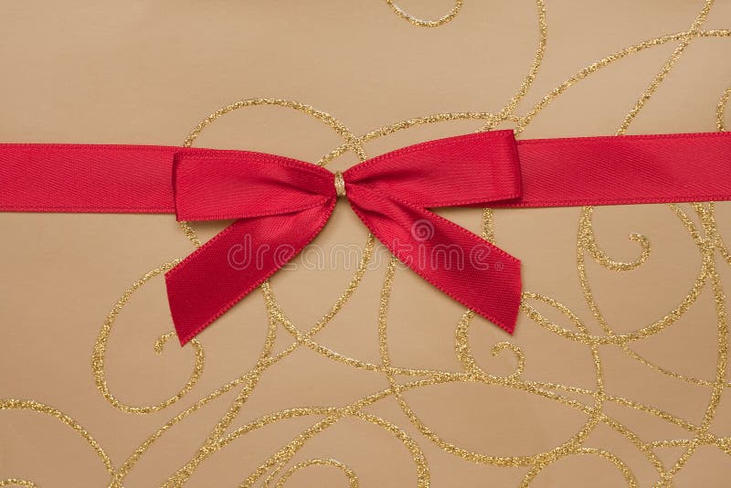 Parcel with Gold Paper and Red Ribbon Stock Photo - Image of paper ...