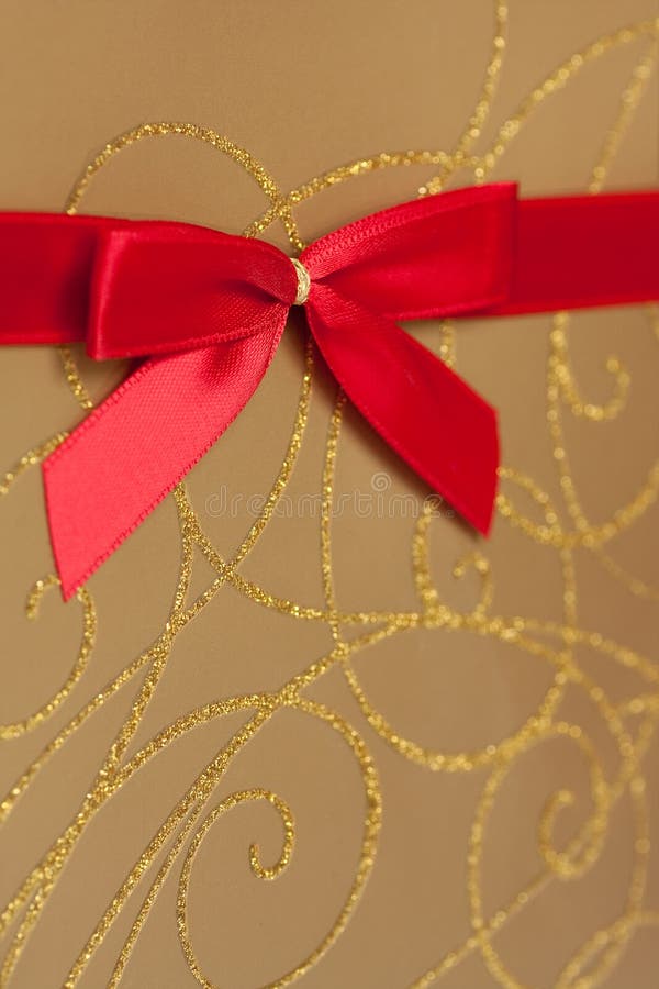 Parcel with Gold Paper and Red Ribbon Stock Photo - Image of colourful ...