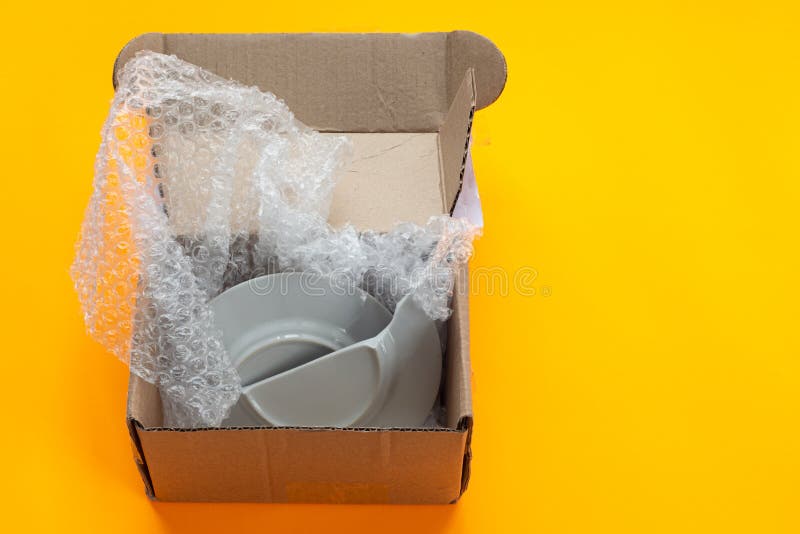 A Parcel from an Online Store Packed in a Box, the Dishes Were Broken ...