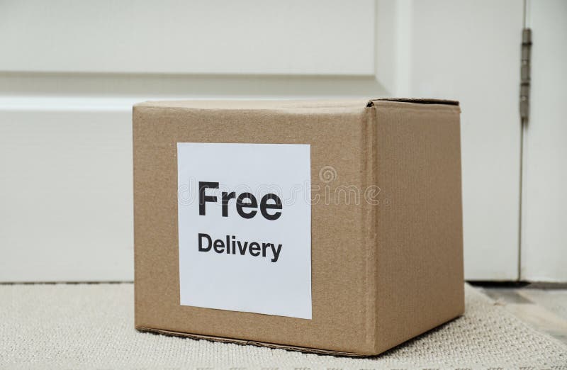 Parcel with Sticker Free Delivery on Rug. Courier Service Stock Image ...