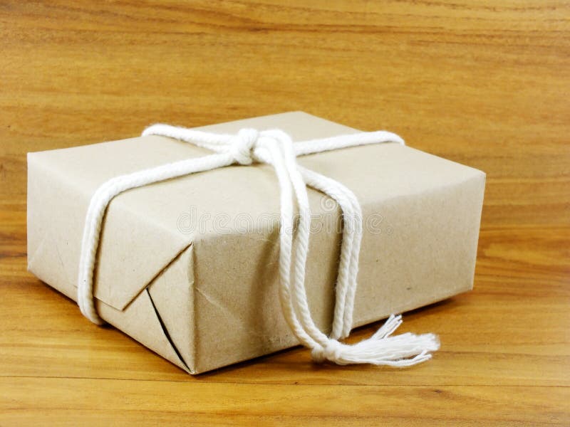 Parcel Wrapped in Brown Paper Stock Photo - Image of carton, fragile ...