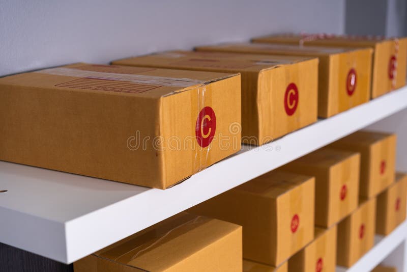 Parcels on Shelf Ready for Shipment To Client in Home Office Stock ...