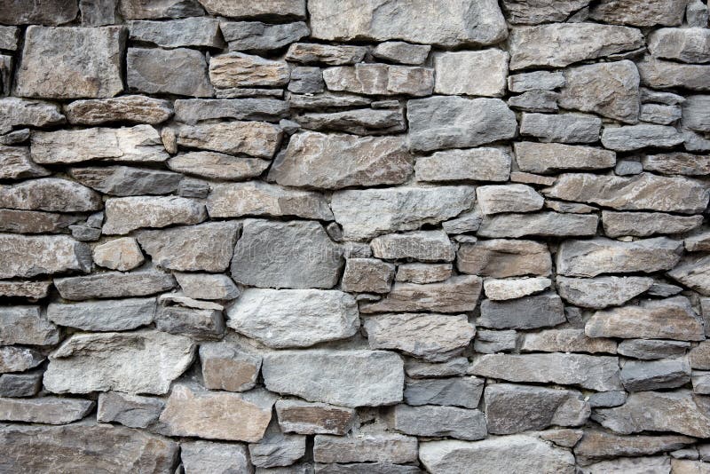 Pared De Piedra Moderna De La Roca De La Fachada Imagen de archivo ...