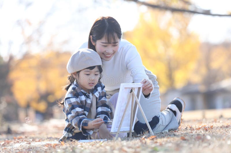 Parent and Child Drawing Pictures Stock Photo - Image of sunny, park ...