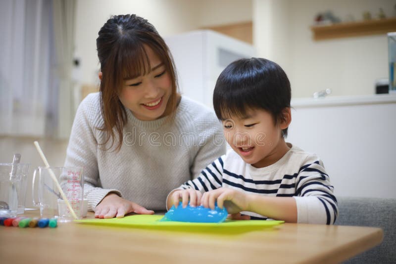 Parent and Child Making Slime Stock Photo - Image of refreshing, child ...