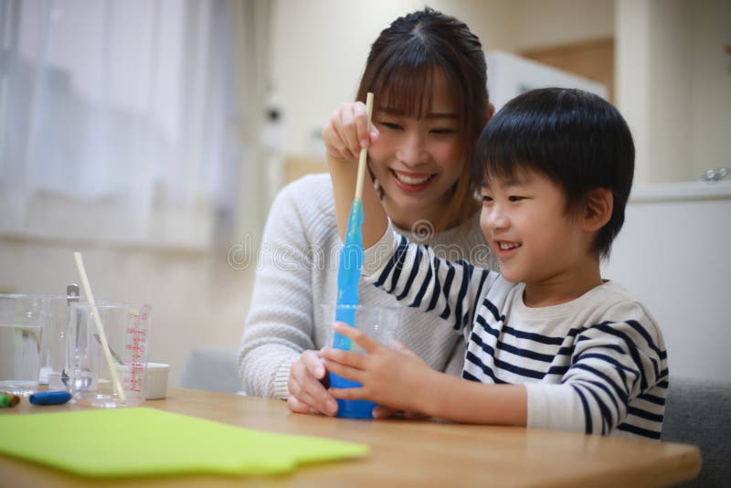 Parent and Child Making Slime Stock Photo - Image of learning, smile ...