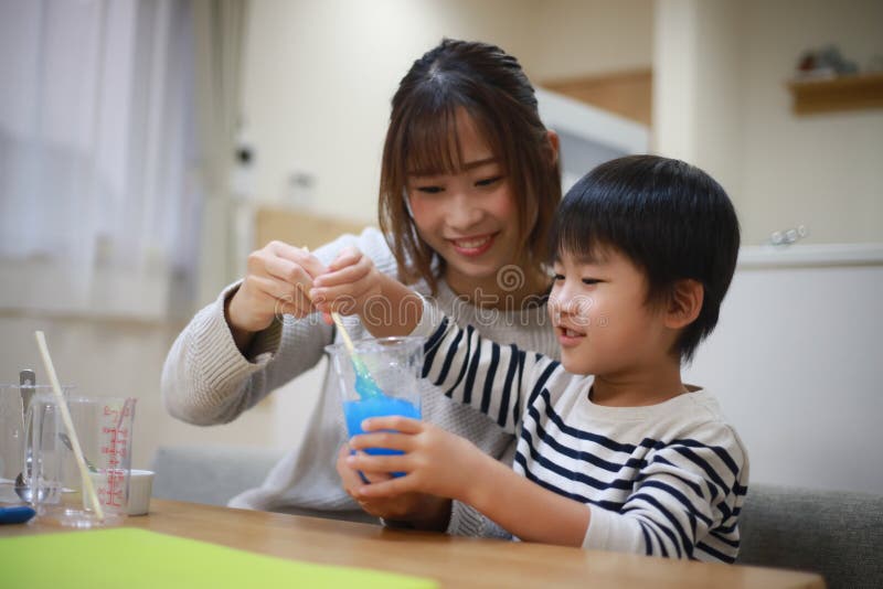 Parent and Child Making Slime Stock Photo - Image of child, play: 238153344