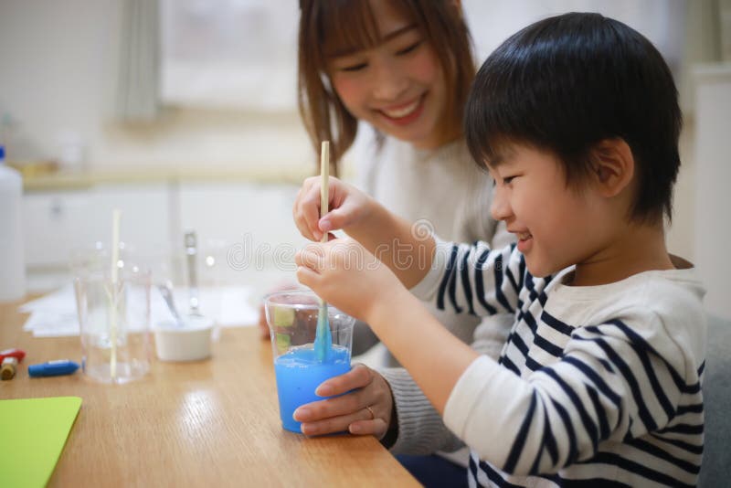 Parent and Child Making Slime Stock Photo - Image of mother, bright ...