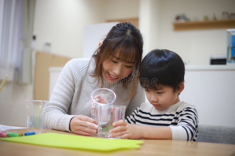 Parent and Child Making Slime Stock Photo - Image of mother, children ...