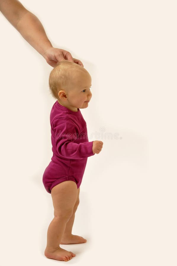 Parent Helping Baby To Walk Stock Image - Image of indoors, walking ...