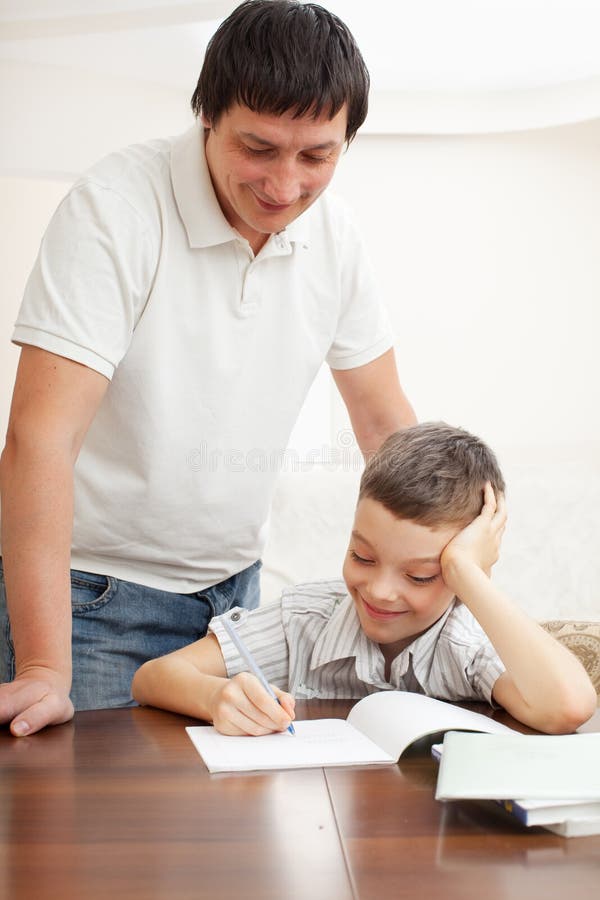 Parent Helps His Child Do Homework Stock Photo - Image of parenthood ...