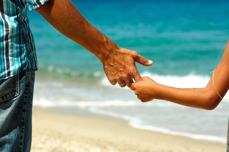 The Parent Holds the Child`s Hand on the Beach Stock Image - Image of ...