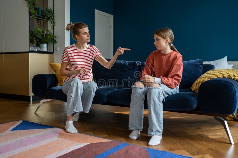 Strict Mother Scolding Lecturing Upset Teenage Girl Daughter At Home