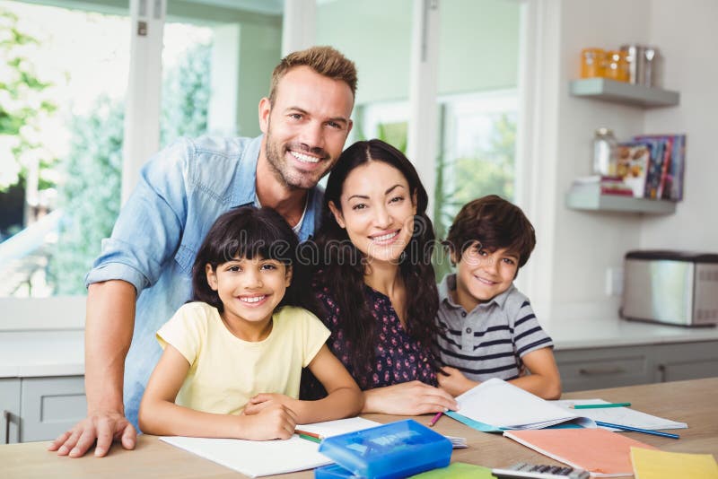 Parents Assisting Children Doing Homework Stock Image - Image of ...