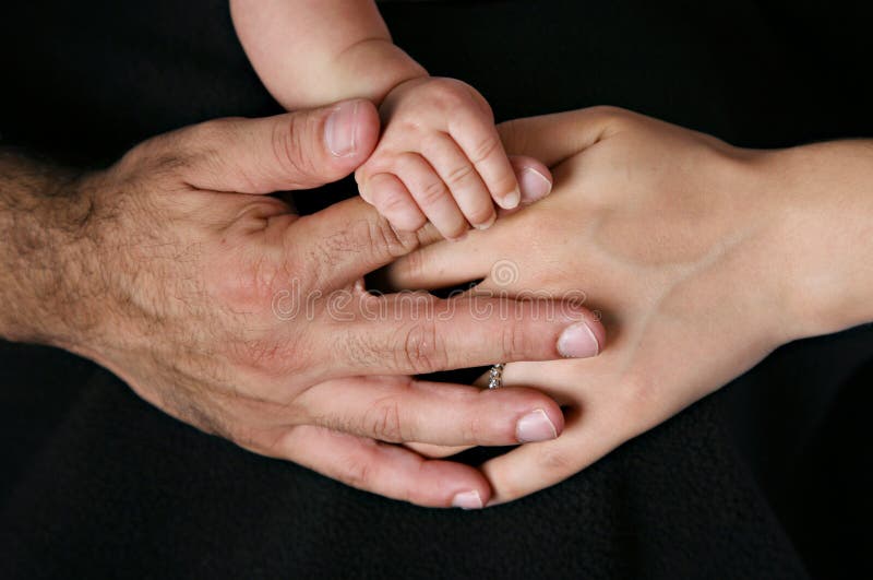Parents and Baby Holding Hands Isolated on Black Stock Photo - Image of ...