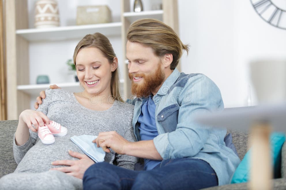 Parents Checking Baby Presents Stock Photo - Image of bonding ...