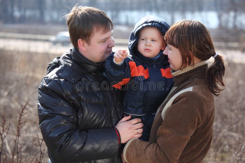 Parents with Child on Hands Stock Photo - Image of human, girl: 9704794