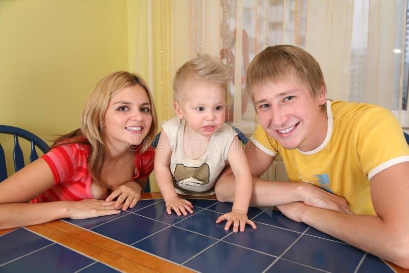 Parents With Child Sit At Table Picture. Image: 4038913