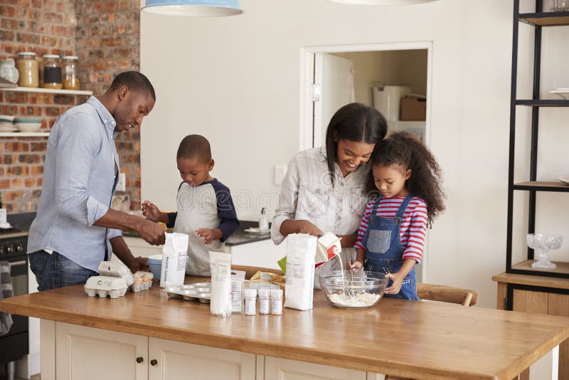 Parents and Children Baking Cakes in Kitchen Together Stock Image ...