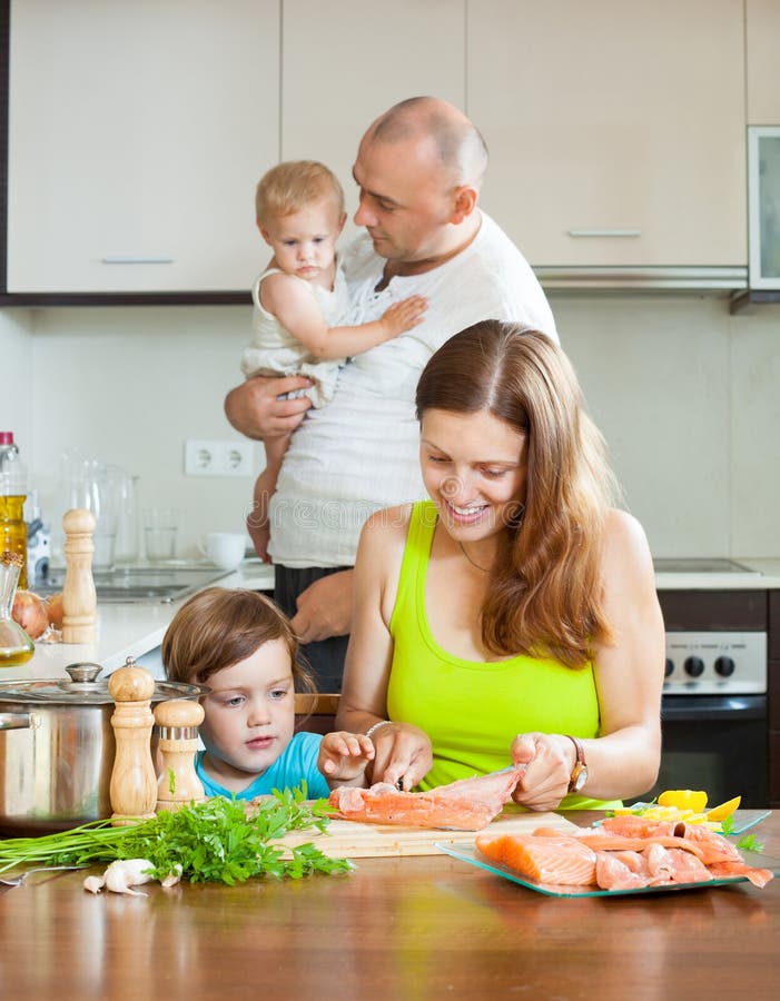 Parents with Children Docile Fish Cooking in a Home Kitchen Stock Photo ...