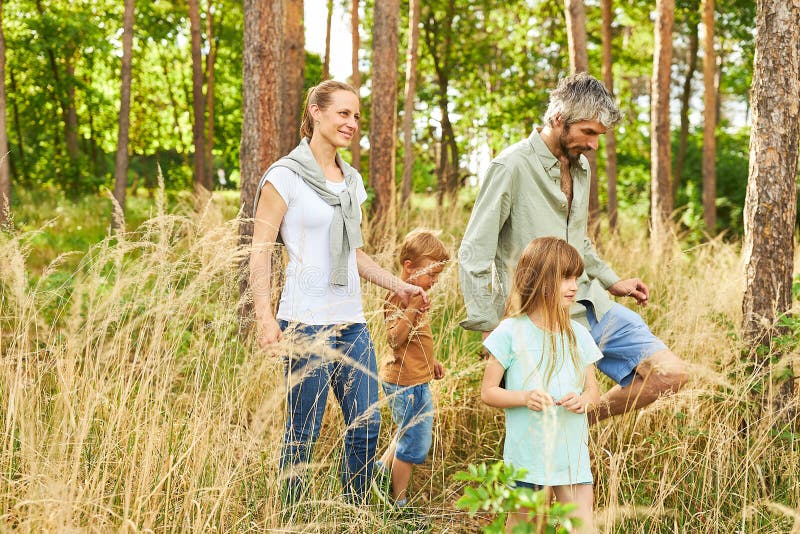 Family Exploring Forest while Hiking during Summer Vacation Stock Photo ... Family Exploring Forest while Hiking during Summer Vacation Stock Photo ...