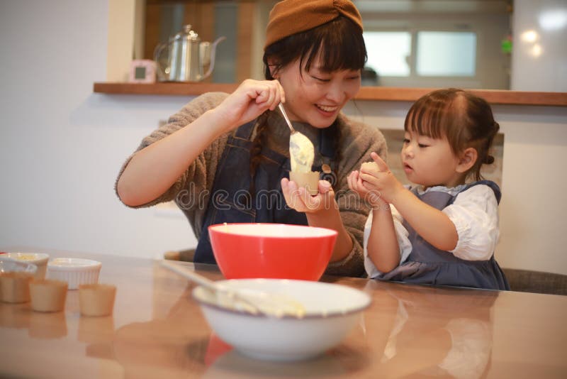 Parents and Children Making Sweets Stock Photo - Image of living, girls ...