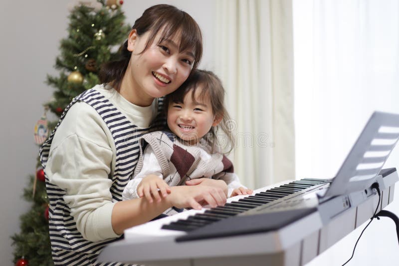 Parents and Children Practicing Playing the Piano Stock Photo - Image of japan, house: 324839522