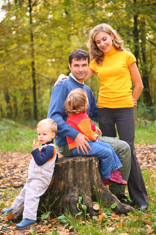 Parents with Children Sit on Stub in Aut Stock Image - Image of cute ...