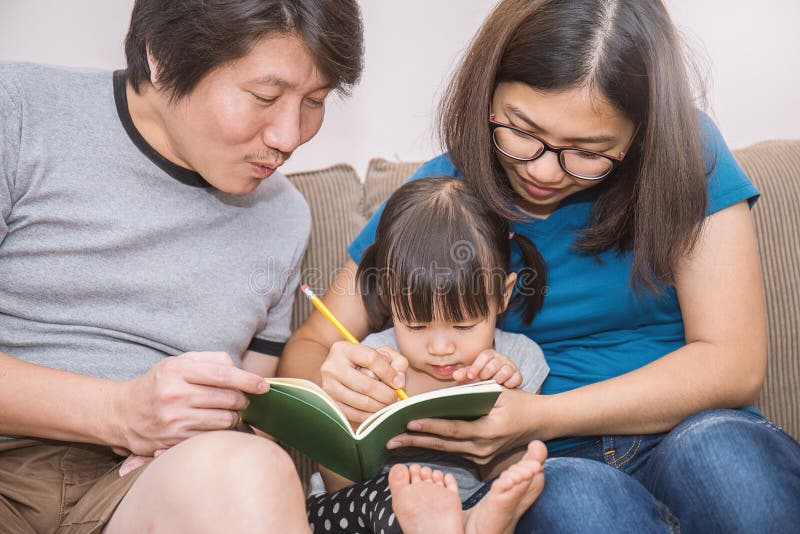 Parents and Daughter are Learning To Write Stock Image - Image of child ...