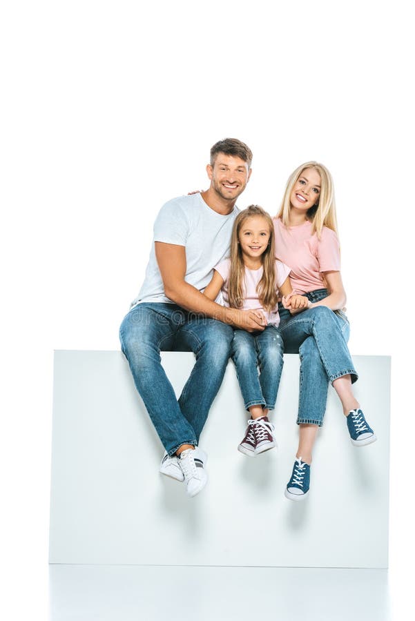 Parents and Daughter Sitting on Cube Stock Photo - Image of denim ...