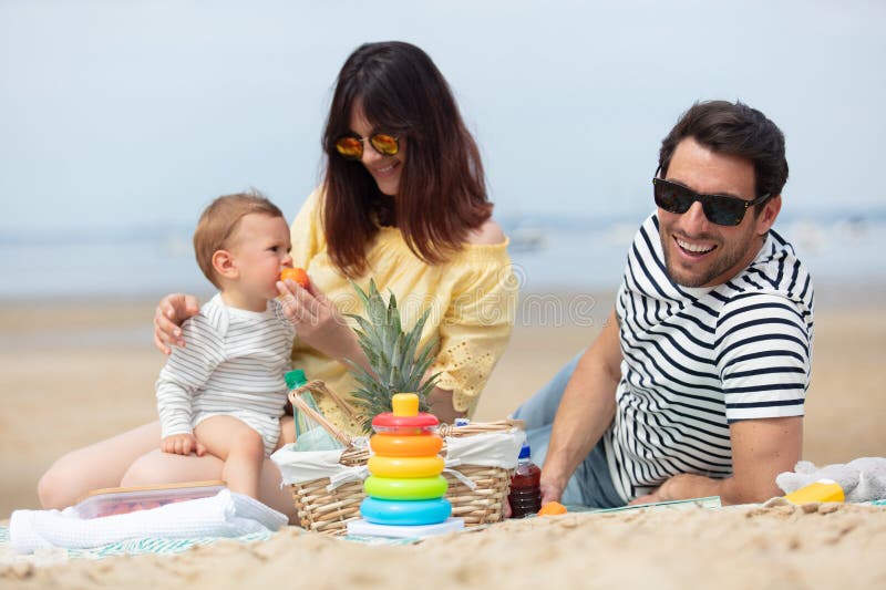 Parents Exploring Beach with Baby Stock Photo - Image of motherhood ...