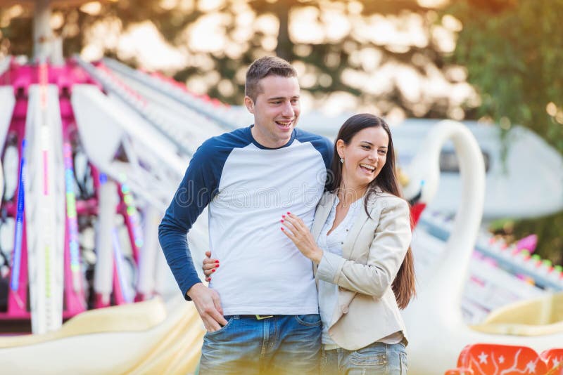 Parents at Fun Fair, Looking at Their Child Taking Ride Stock Image ...