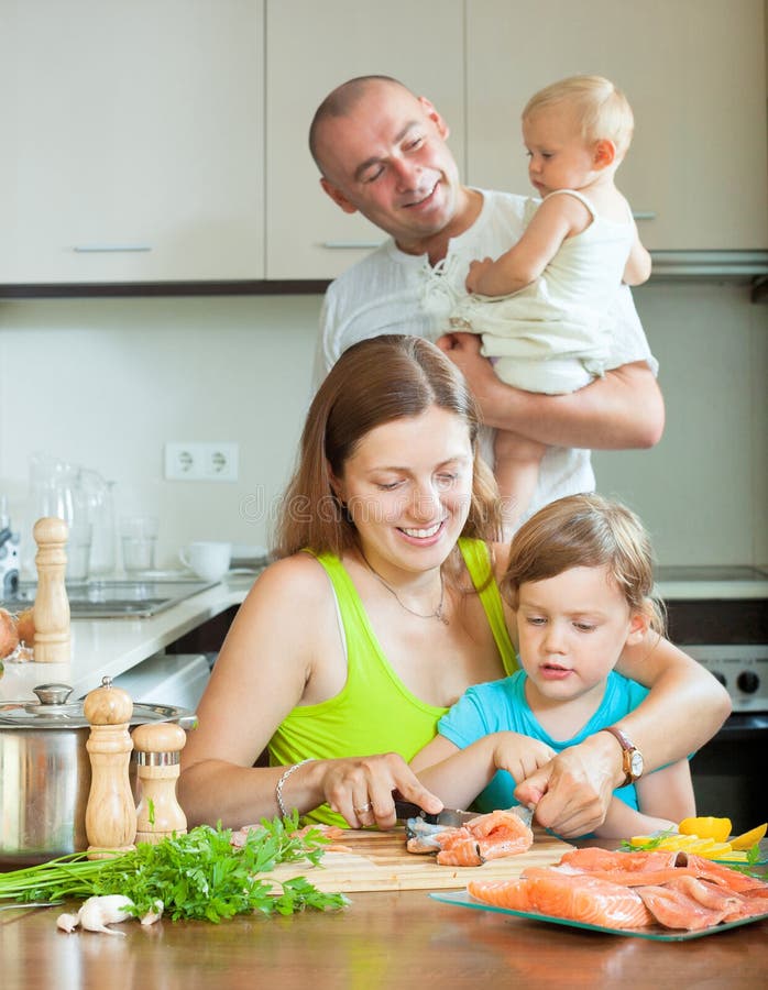 Parents with Good Kids Cooking Fish at Home Kitchen Stock Image - Image ...