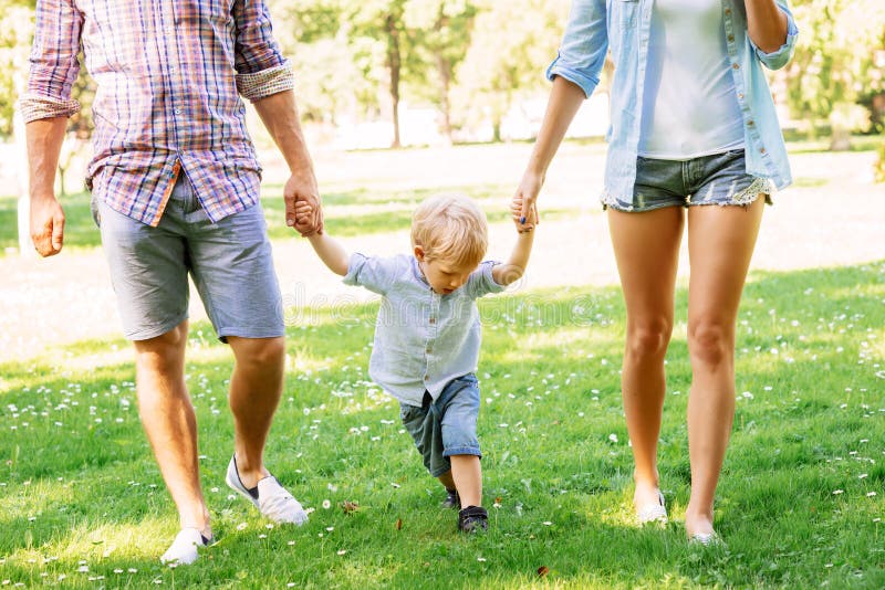 Parents Having a Walk with Son. Stock Photo - Image of mother, child ...